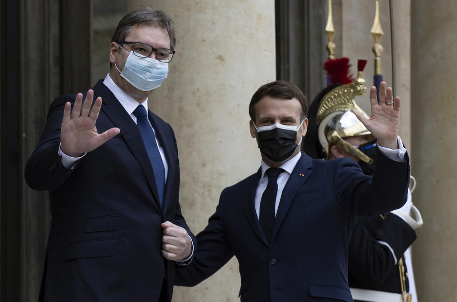 Macron walked Vucic through the wine cellar and offered him support for ...