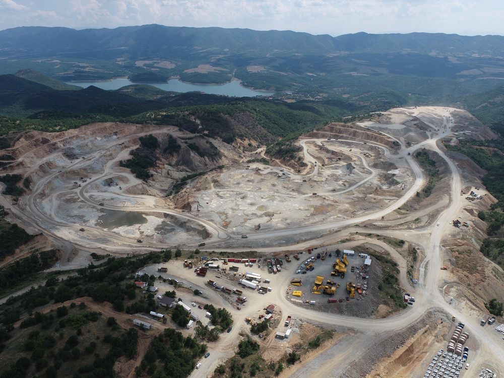 Muddy mixture flows from the new mine "Borov Dol" near Lake Mantovo ...